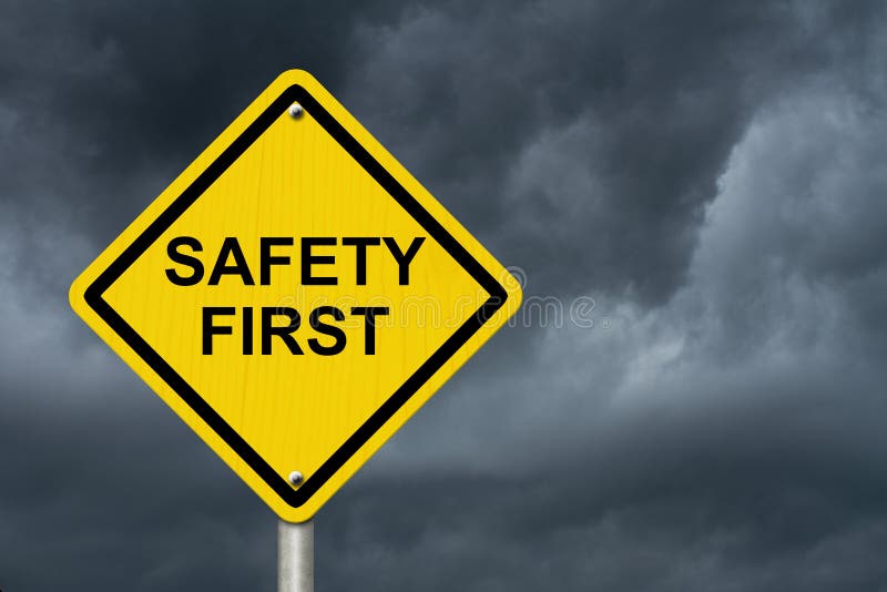 Safety First Yellow Warning Sign Stock Photo - Image of clouds, street ...