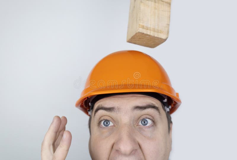 Safety Helmet. Brick and a Board Fall on Builder Head. Saving a Life ...