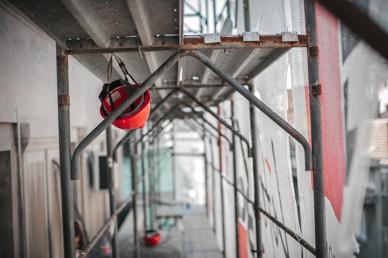 Safety Helmet in Construction Site with Scaffolding and Working Tools ...