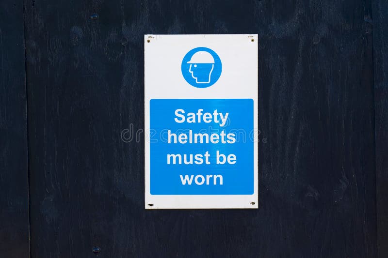 Safety Helmets Must Be Worn Sign at Construction Site Stock Image ... Safety Helmets Must Be Worn Sign at Construction Site Stock Image ...