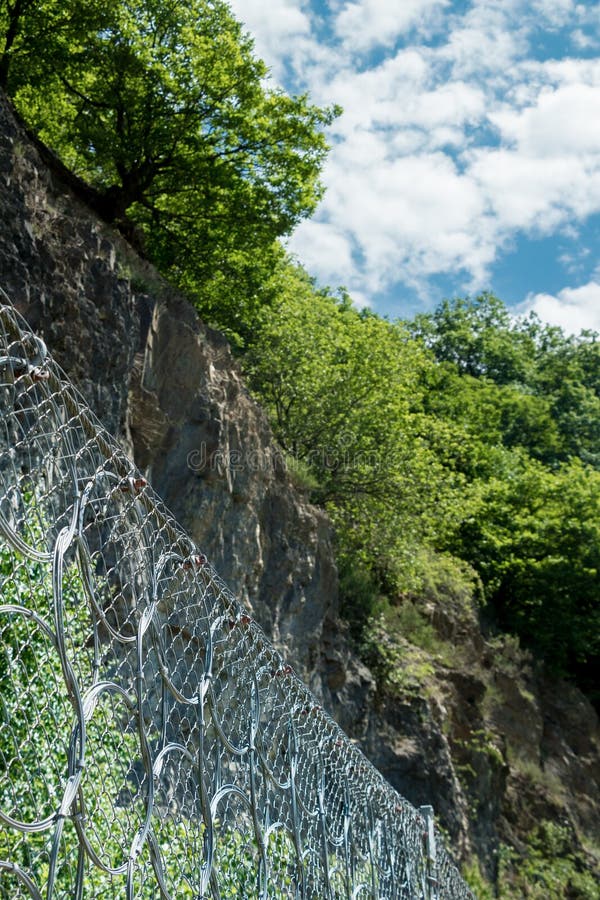 Safety Metal Netting Covers the Rocky Cliffs from Falling Rocks Stock ...