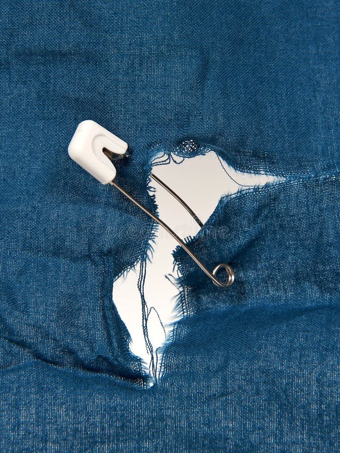 Safety Pin Holding Torn Fabric Stock Photo - Image of repair, cyan ...