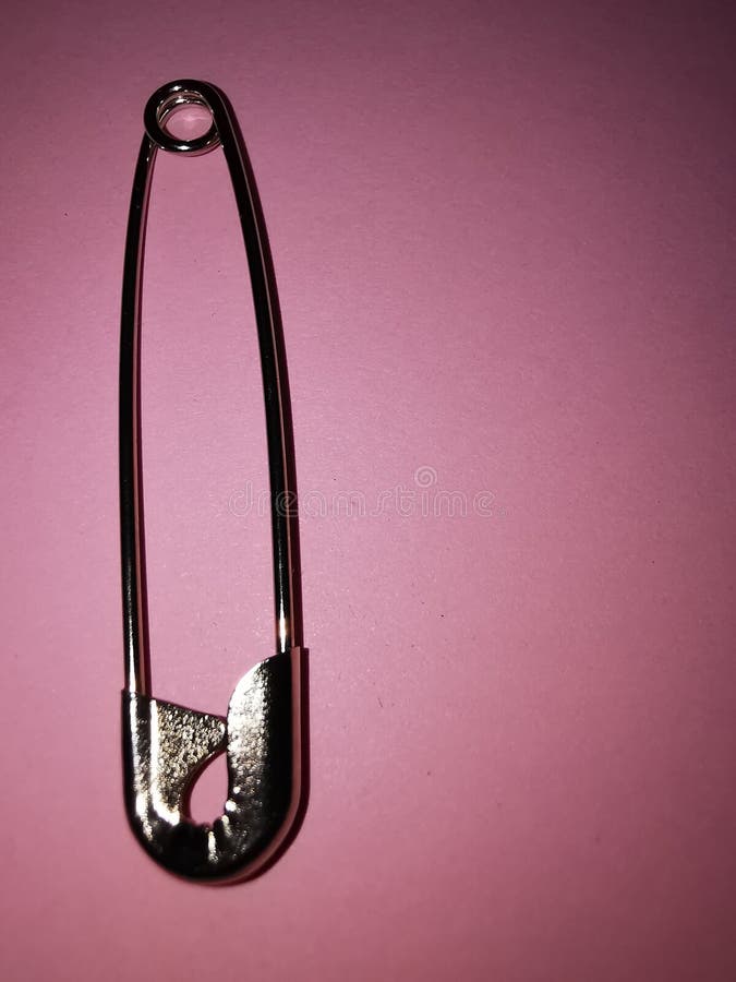 Safety Pin on a Pink Background Close-up. Stock Photo - Image of ...