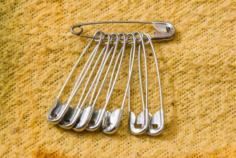 Safety Pin Pinned To the Texture Fabric Stock Photo - Image of attached ...