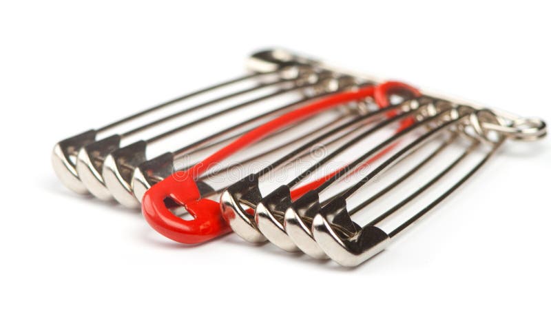 Safety pins with one red stock image. Image of metal - 17256899
