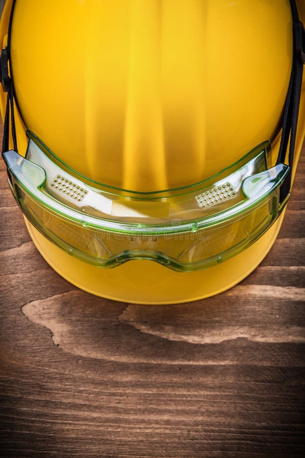 Safety Spectacles and Hard Hat on Wooden Board Construction Conc Stock ...