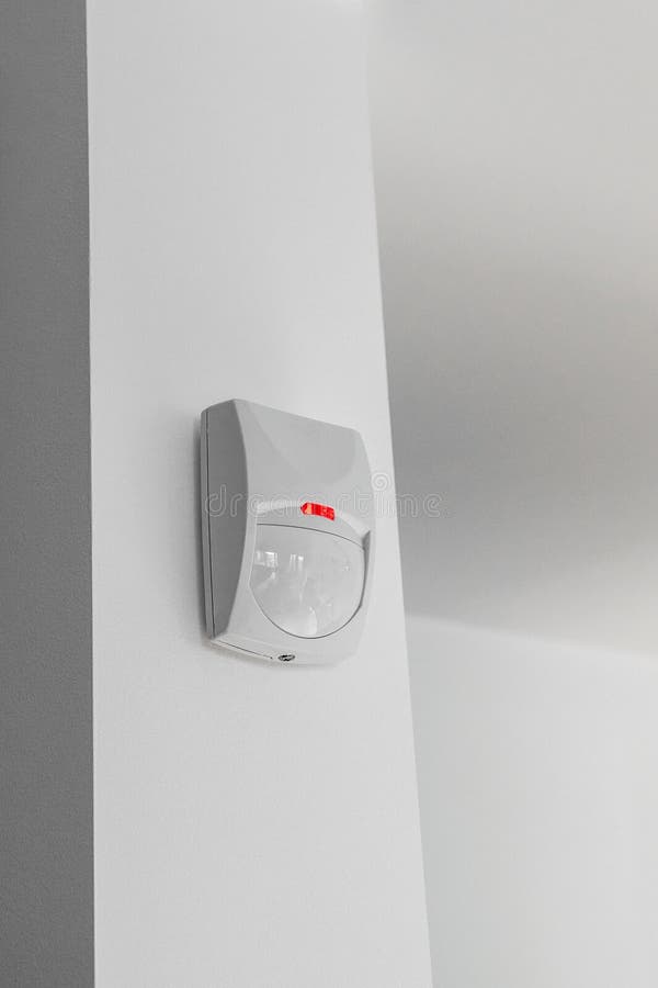 Safety System. Motion Sensor of the Security System on a White Wall ...
