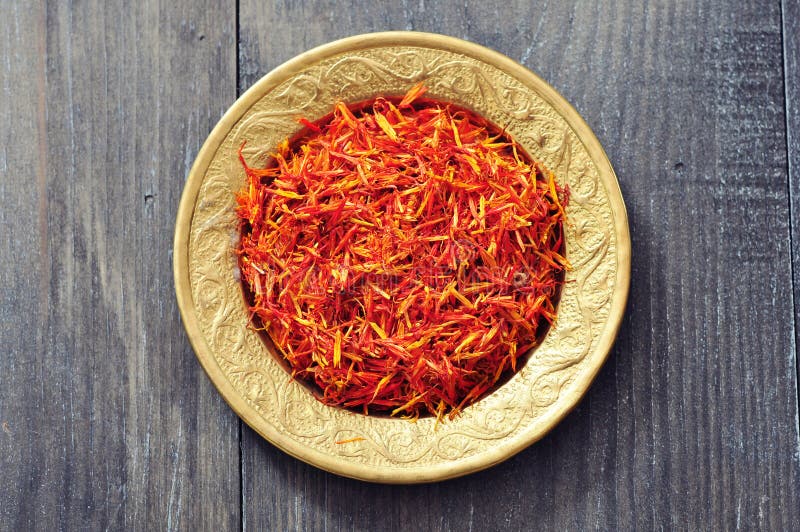 Saffron on golden plate stock image. Image of classic - 36999465