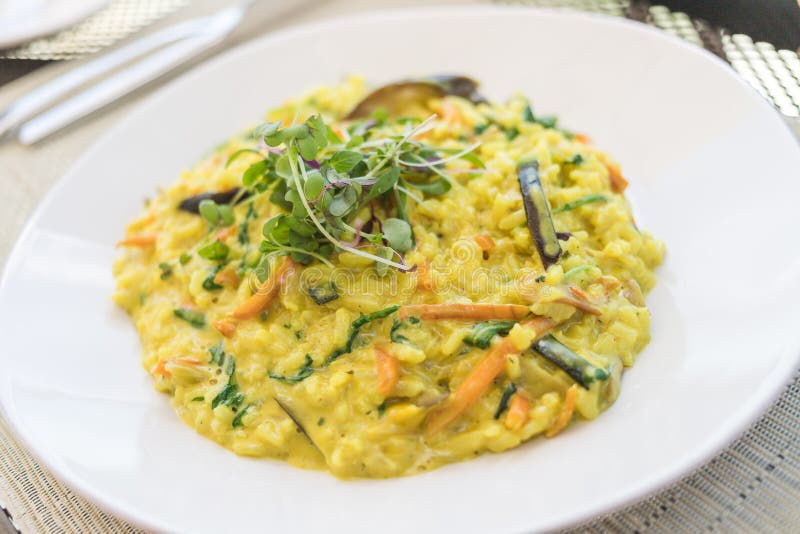 Saffron Risotto Dish with Carrot and Watercress Stock Image - Image of ...