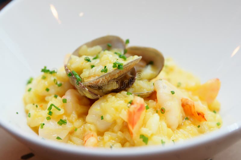 Saffron Risotto with Shellfish in White Plate, Close-up Stock Photo ...