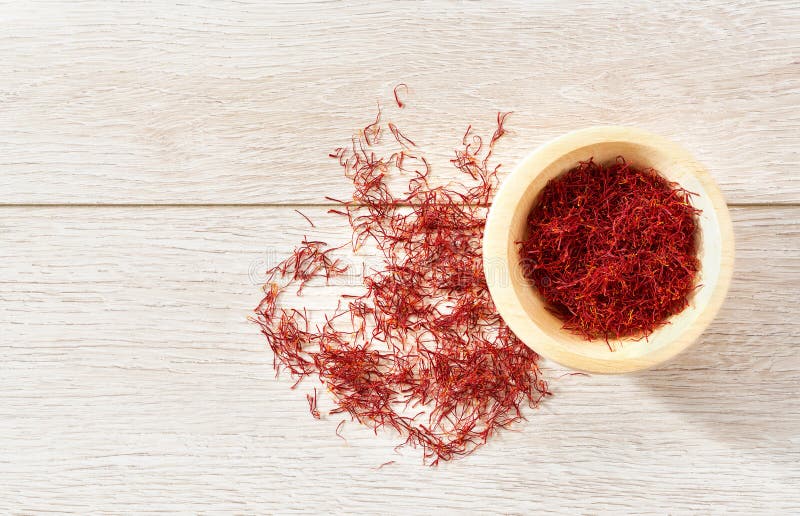 Saffron Thread in a Wooden Bowl on a White Table, Top View Stock Image ...