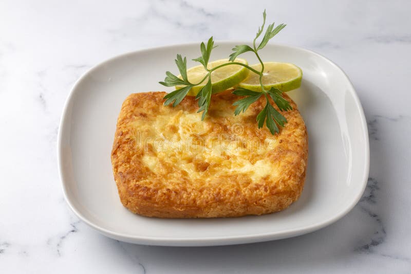 Saganaki is a Greek Delicacy of Fried Cheese Stock Photo - Image of ...
