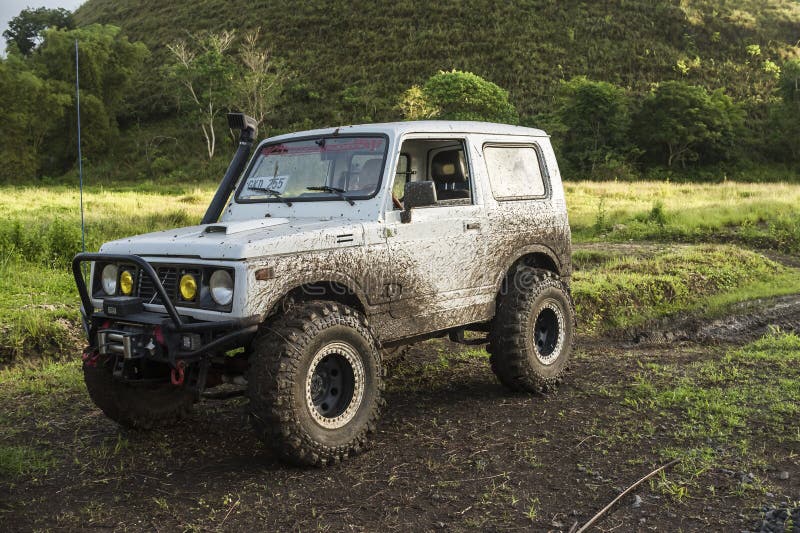 Sagbayan, Bohol, Philippines - a Suzuki Samurai SJ413 at a Muddy Dirt ...