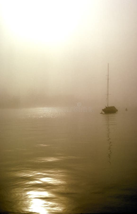 Sail boat in the fog stock photo. Image of mast, line, reflection - 37588