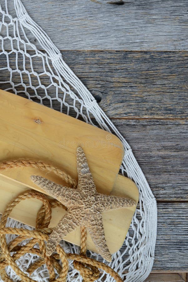 Sail Oars with Fish Net, Rope and Starfish on Wood Stock Image - Image ...