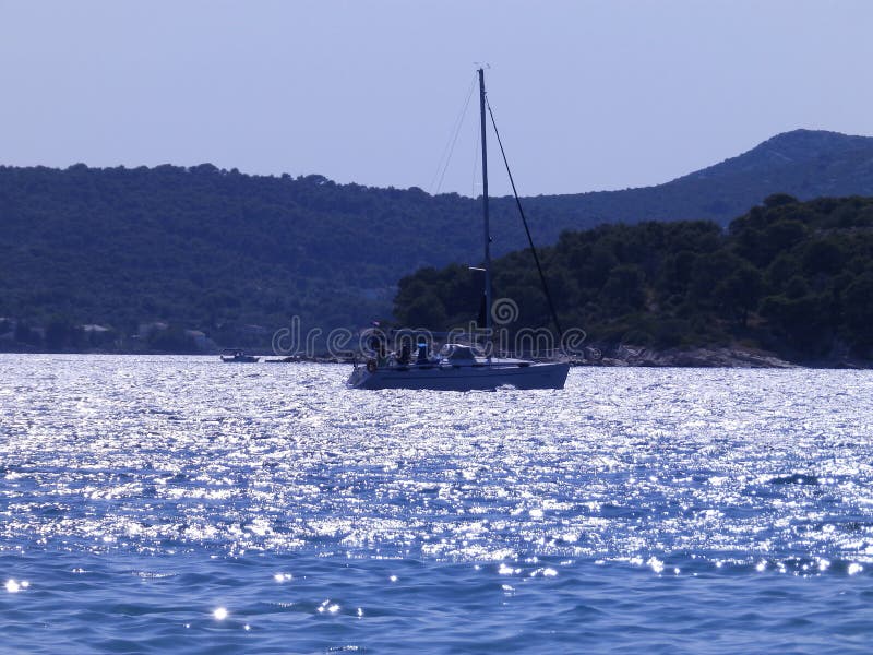 Sailboat between islands stock image. Image of gloss - 71052811