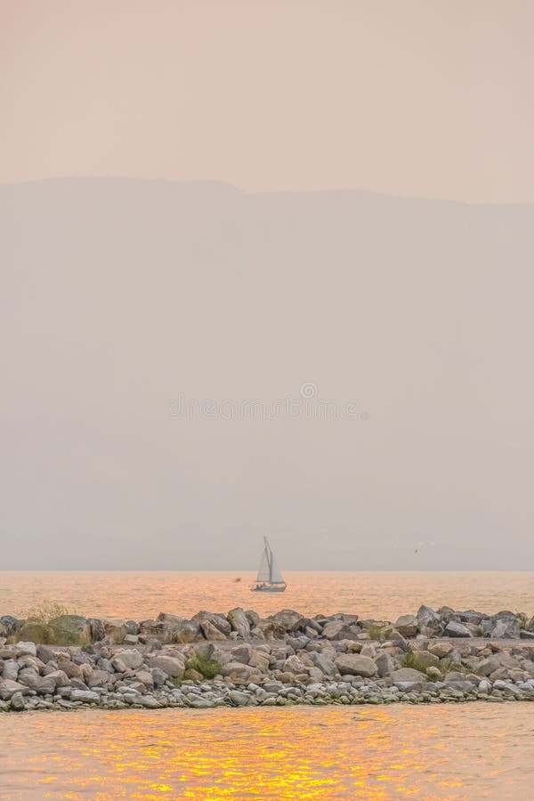 Sailboat in Lake Utah with Reflection of Sunset Stock Image - Image of ...