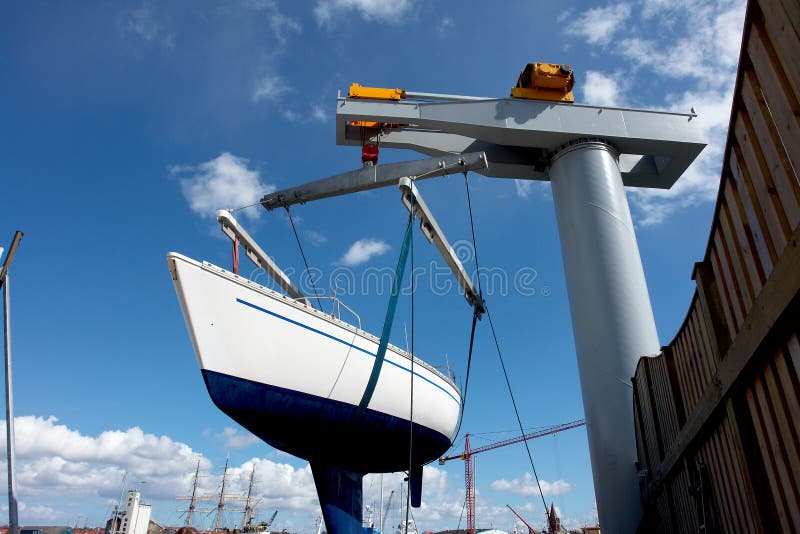 Sailboat Lift Up by a Boat Lifter Stock Photo - Image of outdoor, large ...
