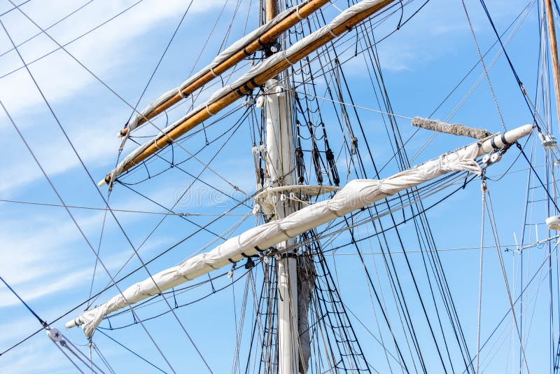 Sailboat Masts, Rigging and Rolled Up Sails Stock Photo - Image of ...