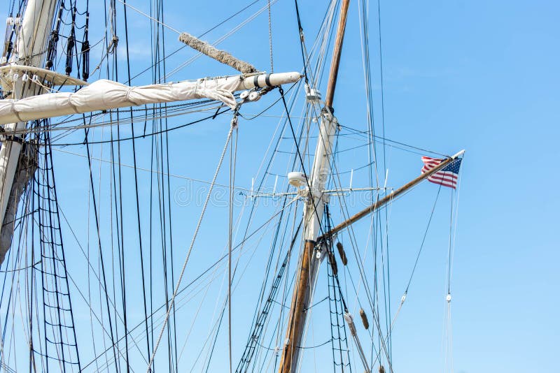 Sailboat Masts, Rigging and Rolled Up Sails Stock Photo - Image of ...