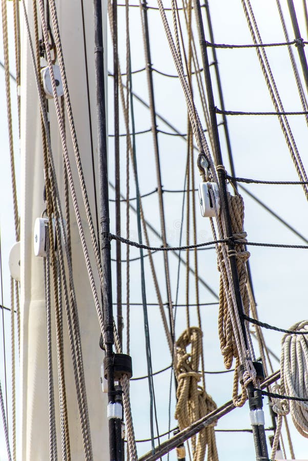 Sailboat Masts, Rigging and Rolled Up Sails Stock Photo - Image of ...