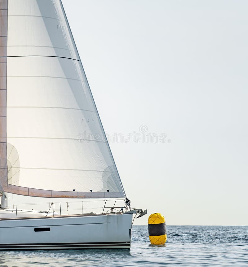 Sailboat and Yellow Buoy Under White Sky for Text Stock Image - Image ...