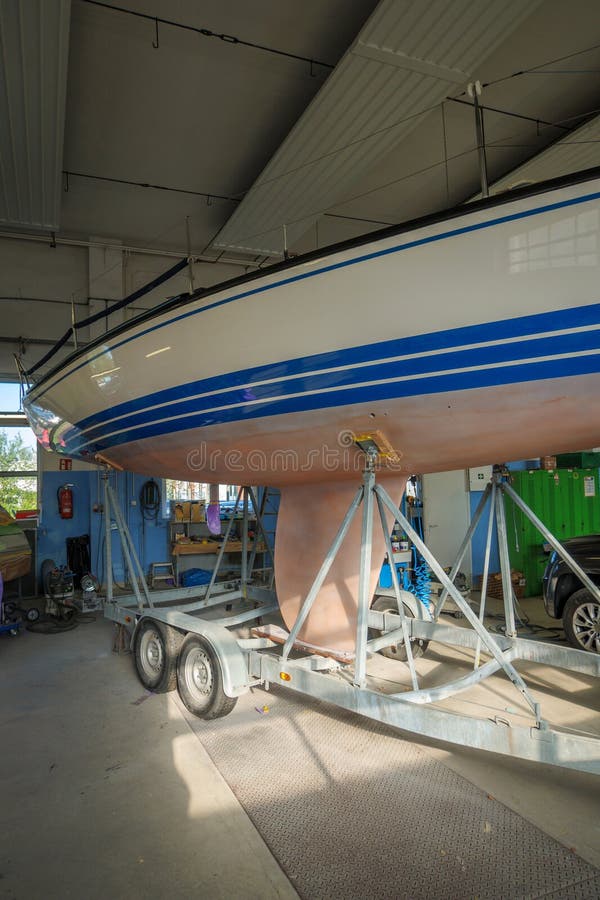 A Sailboat is in the Paint Shop for Painting Stock Image - Image of ...