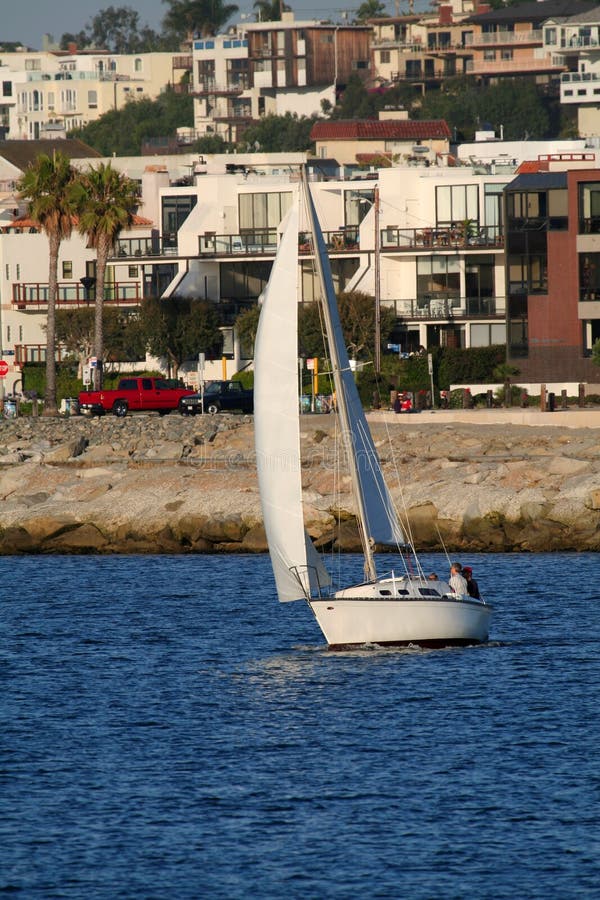 Sailboat reaching stock image. Image of sunset, coast, wave - 990063