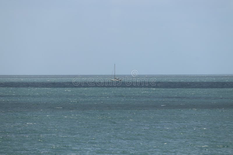 Sailboat Riding the Choppy Waves Off the Cornish Coast Stock Image ...
