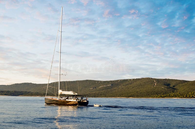 Sailboat in the Plain Sea Sailing between the Lavezzi Islands Stock ...
