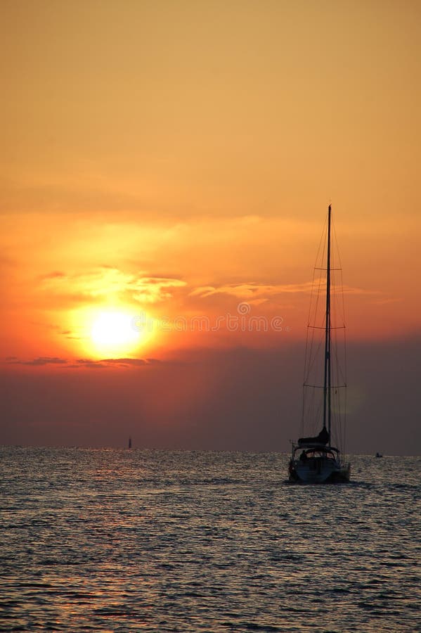 Sailing into the sunset stock photo. Image of dusk, burning - 14806832