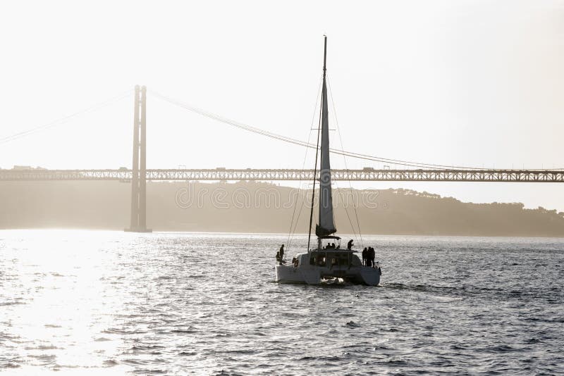 Sailboat Sails the River Heading for the Bridge Stock Photo - Image of ...