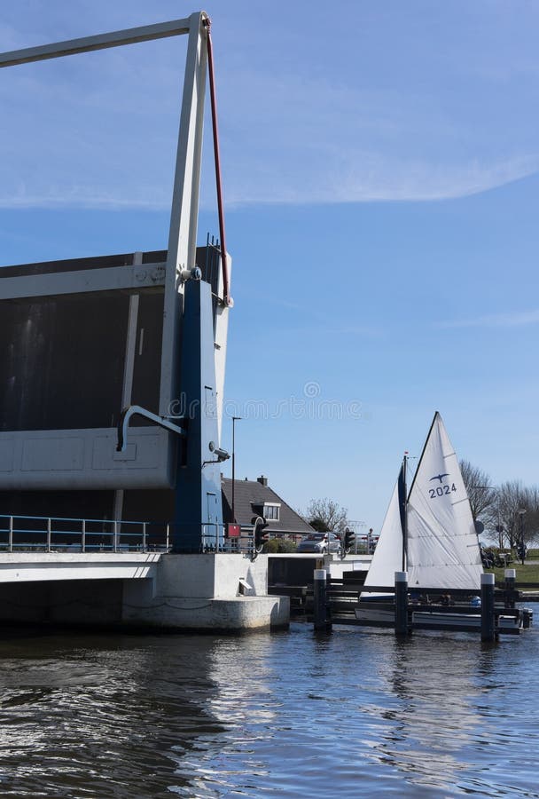 Sailboat Sails Under the Opened Drawbridge in the Netherlands Stock ...