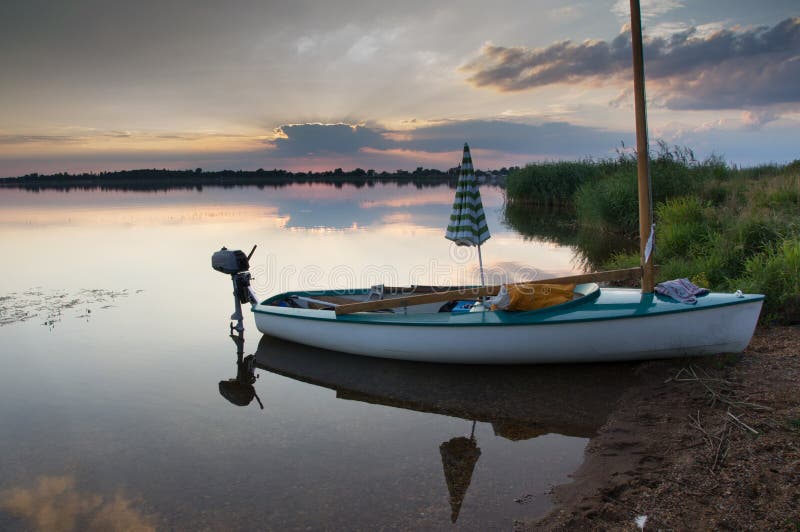 Sailboat stranded stock image. Image of beach, parasol - 69635691
