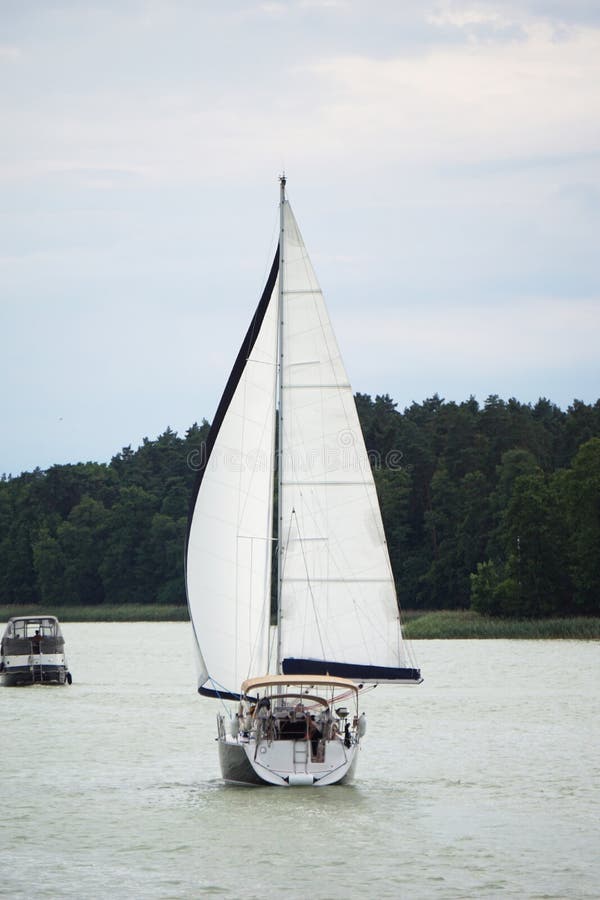 Sailboat Swimming on a Lake - Back View Editorial Photo - Image of ...
