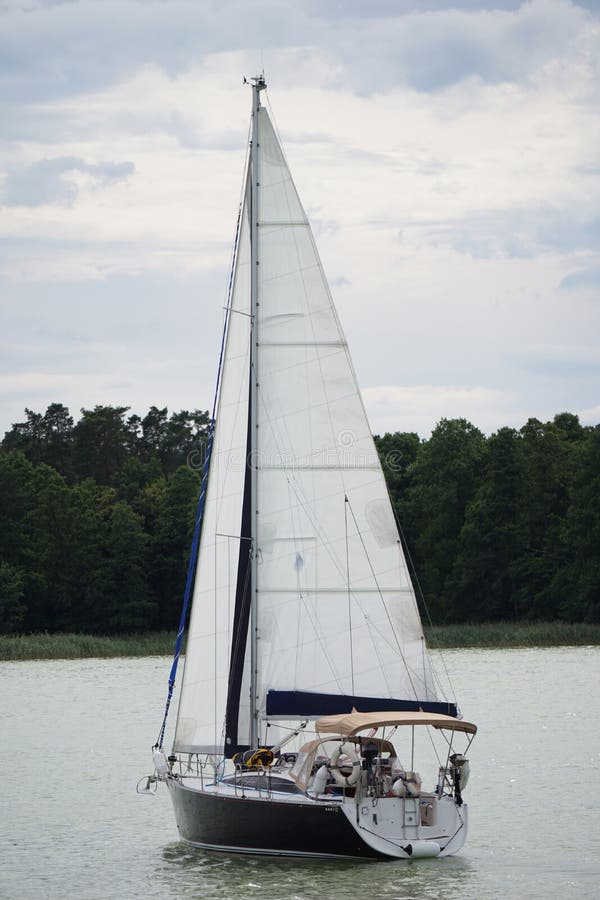 Sailboat Swimming on a Lake - Back View Editorial Stock Photo - Image ...