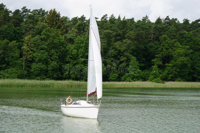 Sailboat Swimming on a Lake - Front View Stock Photo - Image of sail ...