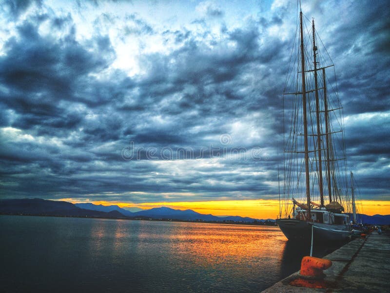 Sailing Boat in the Harbor during a Beautiful Sunset Stock Image ...