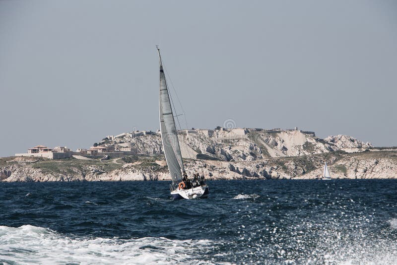 Sailing Boat at the Sea with the Rocks in a Background Stock Photo ...