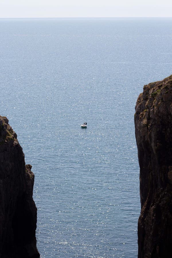 Sailing Boat at the Sea with Rocky Cliff Stock Photo - Image of cloud ...