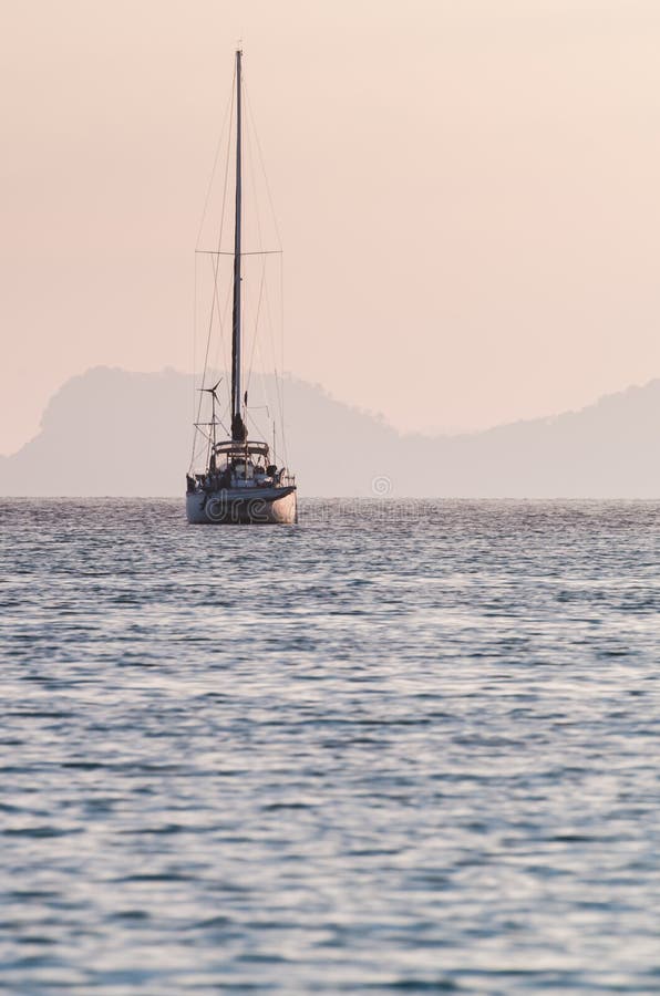 Sailing boat at sunrise stock photo. Image of climate - 31921586