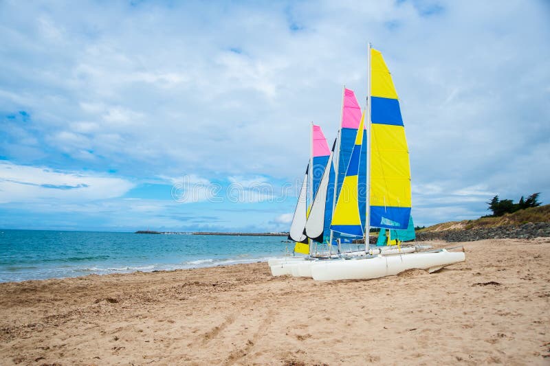 Sailing boats on the beach stock photo. Image of sailing - 133002022