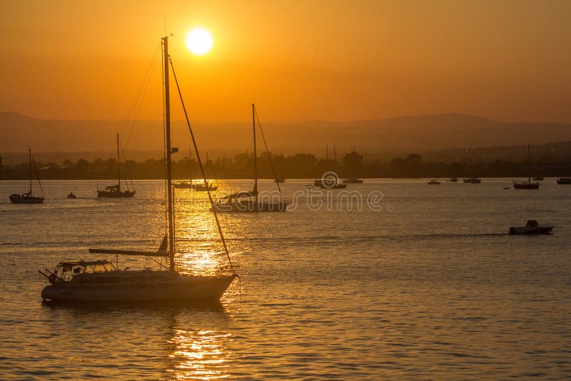 Sailing boats at sunset editorial stock photo. Image of ocean - 44079438