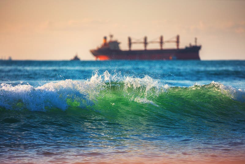 Sailing Cargo Ship and Waves at Sunrise. Transportation. Logistics ...