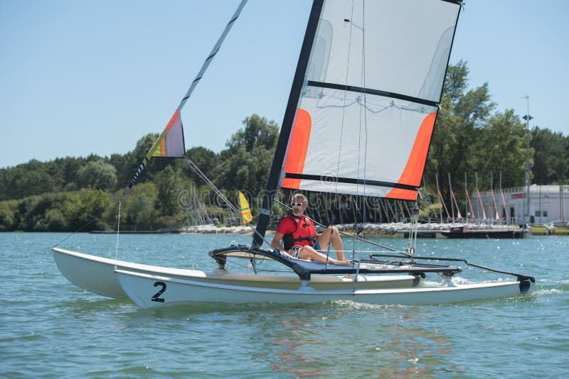 Sailing on the lake stock image. Image of lifejacket - 122043469