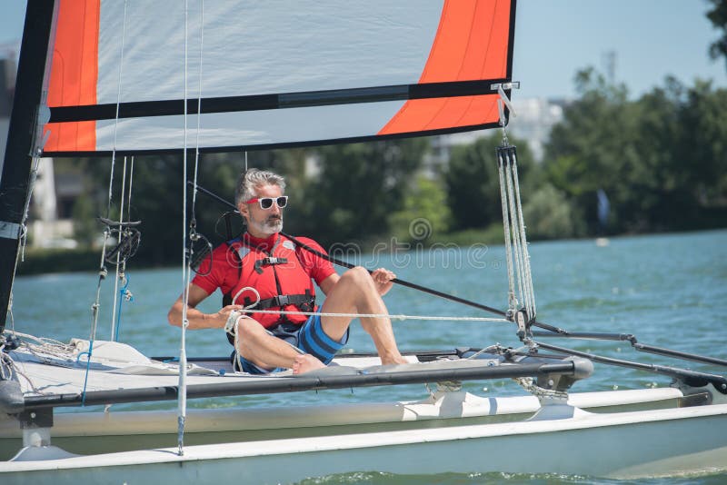 Sailing man on boat stock image. Image of nautical, relax - 127174015
