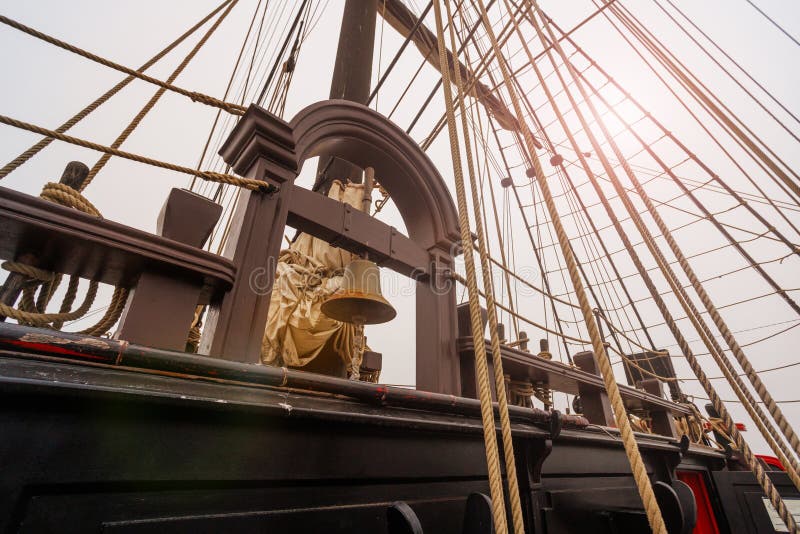 Sailing Ship Rigging and a Bell Against the Bright, Sunlit Sky Stock ...