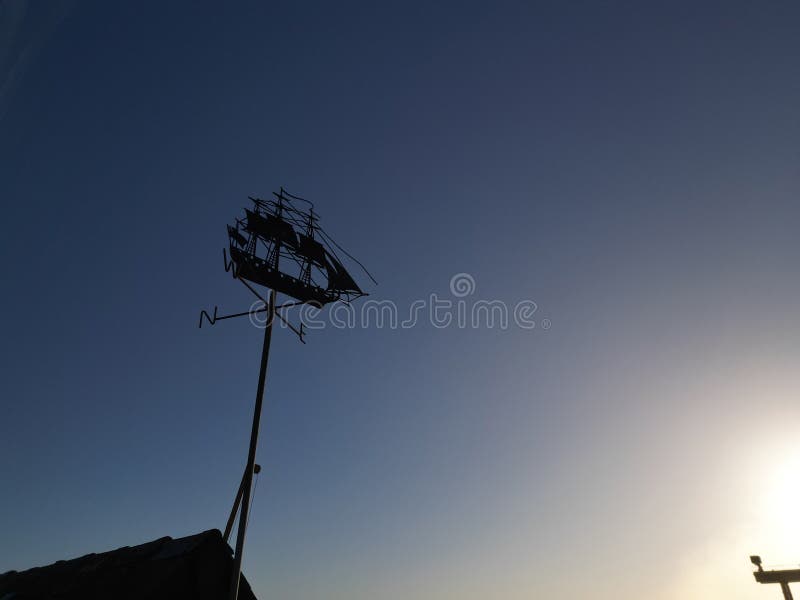 Sailing Ship Shaped Weather Vane Silhouette at Sunrise Stock Image ...