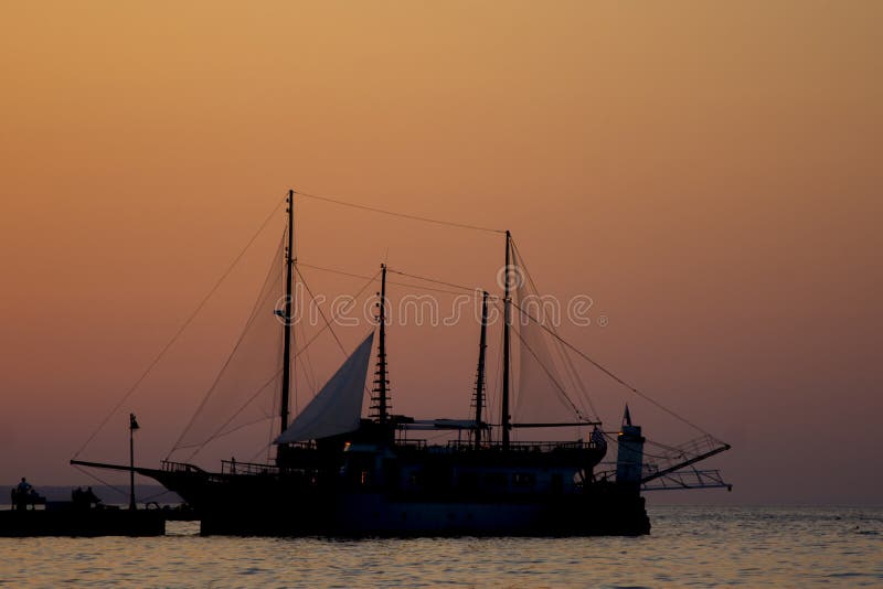 Sailing ship at sunset stock photo. Image of mast, dawn - 68805690