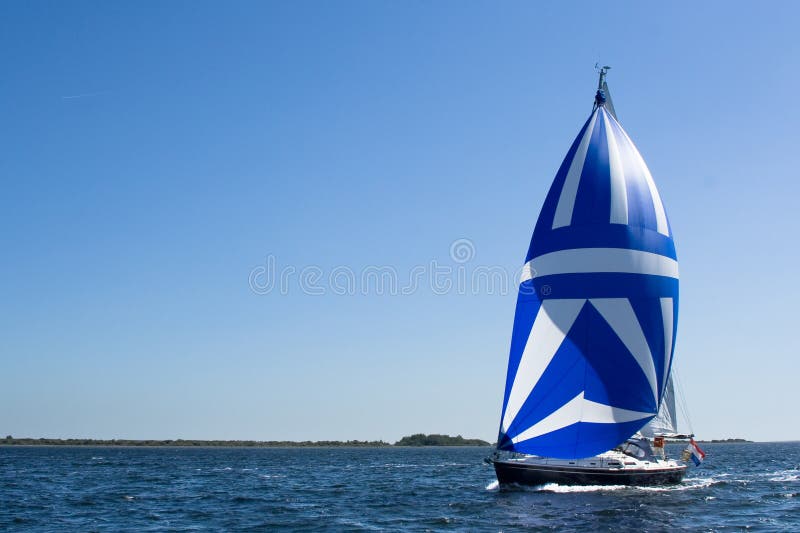 Sailing with a spinnaker stock photo. Image of boat, marine - 12439464